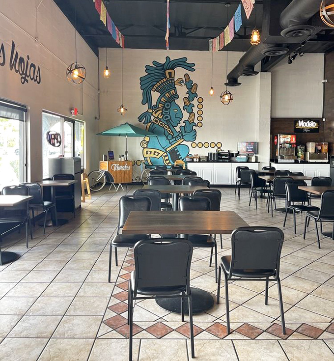 Inside, vibrant Aztec artwork watches over diners enjoying their tamale treasures in a space that feels both authentic and welcoming.