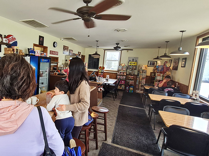Inside Scott's Diner, ceiling fans lazily spin above tables where locals gather, creating that perfect small-town symphony of coffee cups and conversation.