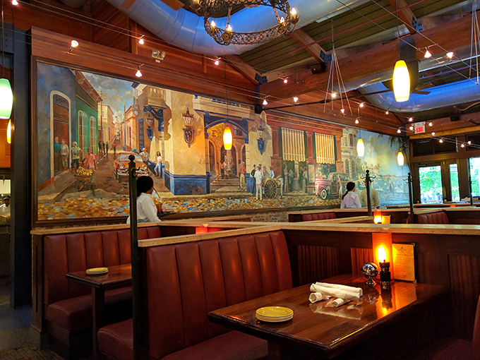 Step inside and you're transported to a coastal getaway, where vibrant murals and warm wood tones create the perfect backdrop for seafood indulgence.