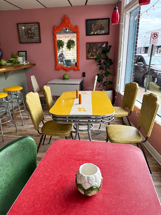 Step into a time capsule of mid-century charm where pink walls, vintage Formica tables, and gold vinyl chairs create the perfect backdrop for Polish comfort food.