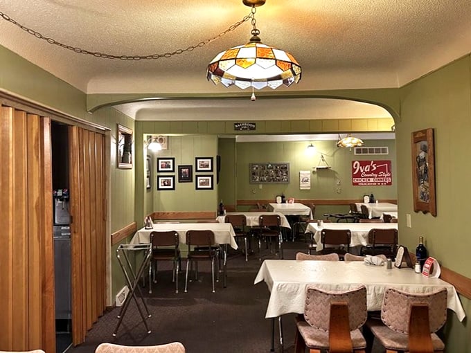 Stained glass pendant lights cast a warm glow over tables where countless "mmms" have been uttered. The green walls and wood accents feel like grandma's dining room&mdash;if grandma was a chicken whisperer.