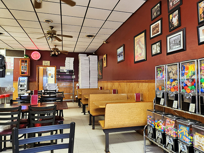 No fancy frills needed here&mdash;just wooden booths, ceiling fans, and enough pizza boxes stacked to build a small fort. This is comfort defined.