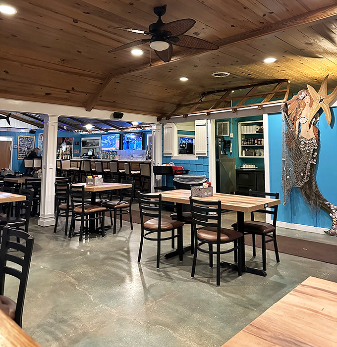Wooden ceiling beams, nautical touches, and that mermaid on the wall&mdash;The Jetty's interior feels like a seafood lover's dream clubhouse.