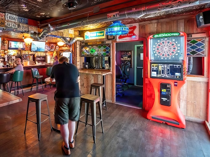 Step inside and the pressed tin ceiling, neon signs, and electronic dartboard tell you everything: this is a place that values substance over Instagram aesthetics.