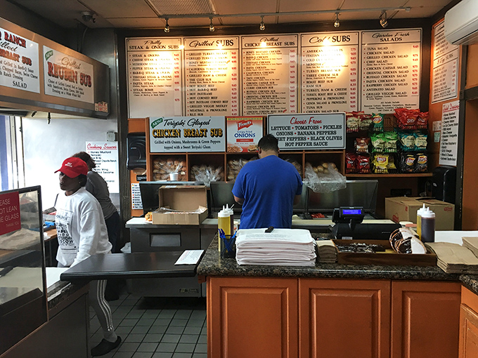 Behind the counter, sandwich artisans work their magic with practiced precision. This is where bread becomes canvas and ingredients become art.