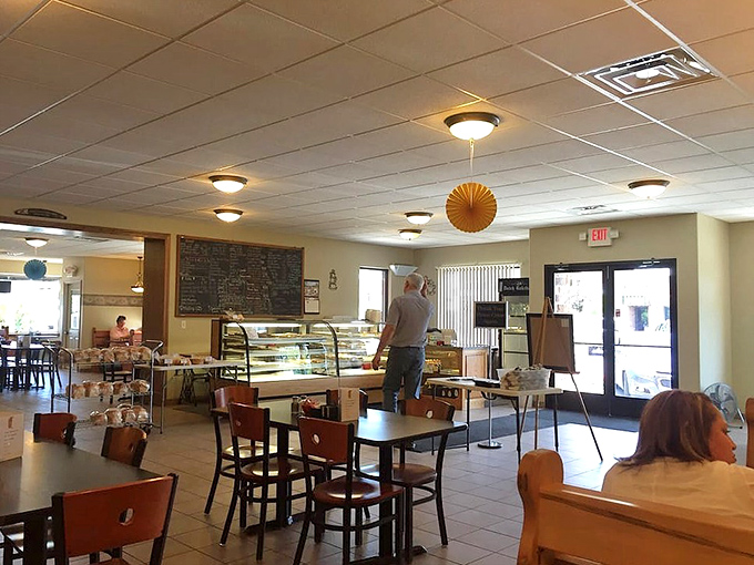 Where comfort meets community. The cafe's warm interior invites you to settle in, chat with neighbors, and contemplate your next pastry conquest.