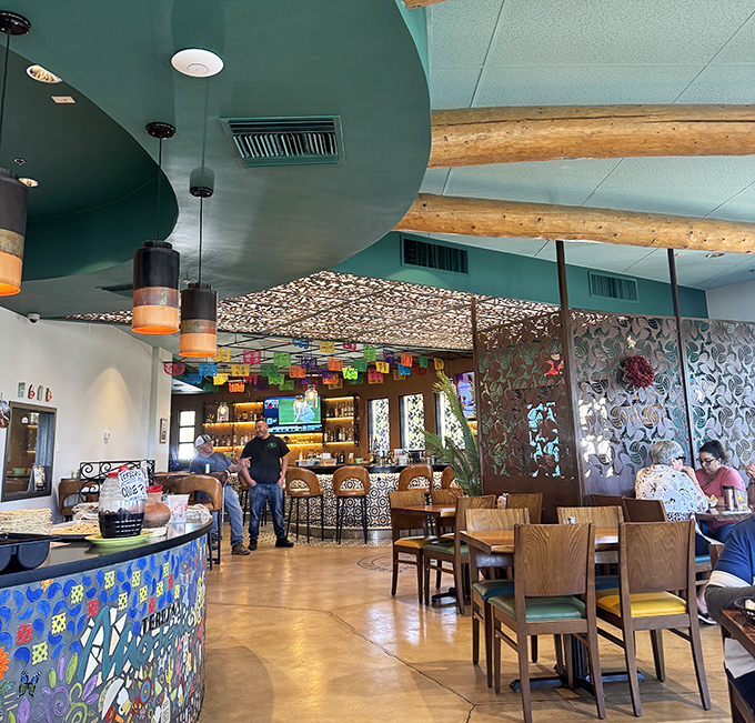 Where wooden beams meet mosaic magic. The interior feels like someone's artistic grandmother got her dream restaurant.