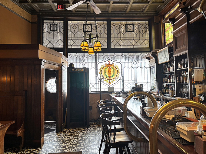 Step back in time at the bar, where stained glass windows, ornate woodwork, and that vintage telephone booth whisper stories of cocktails past.