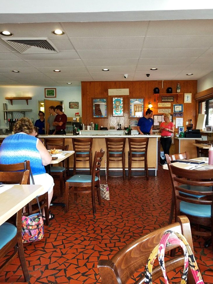 Inside O'Steen's, the classic wood paneling and distinctive terrazzo floor tell you this place has stories to tell—and seafood worth waiting for.