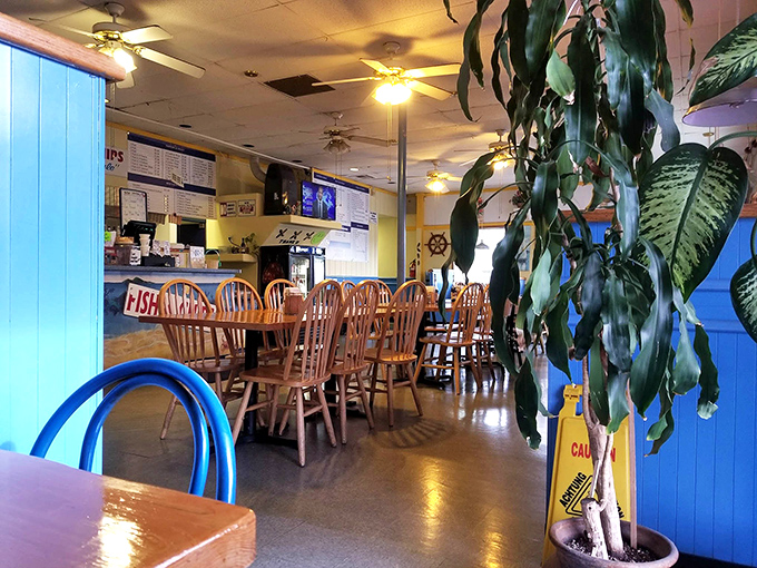 Step into comfort food paradise where wooden chairs and nautical touches create the perfect fish-and-chips atmosphere.