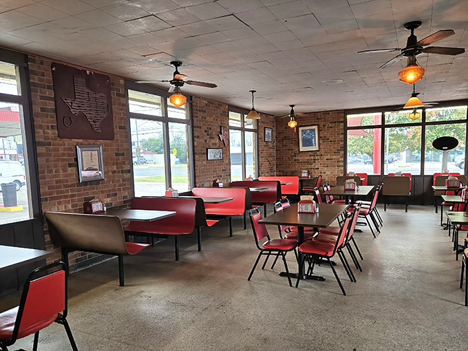 Red vinyl booths and brick walls create the perfect backdrop for conversations that flow as easily as the milkshakes. 