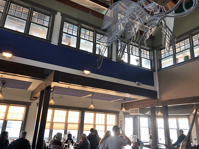 High ceilings, ocean light, and that metal octopus watching over diners—because seafood this good deserves its own guardian.