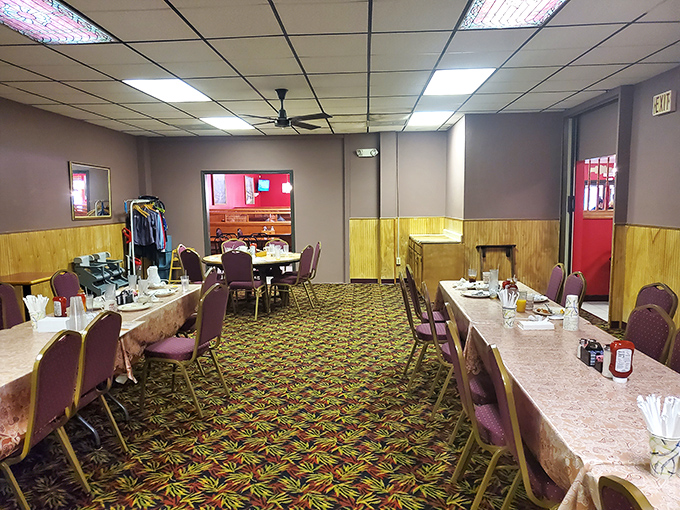 Classic diner charm with wood paneling and patterned carpet that screams "comfort food ahead." This isn't Instagram-bait d&eacute;cor&mdash;it's the real deal.