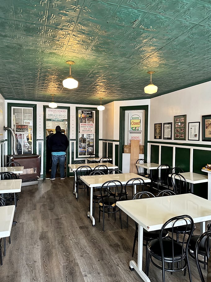 That pressed tin ceiling isn't just vintage charm&mdash;it's witnessed countless "first bite" moments of pure sandwich bliss beneath its mint-green patina.