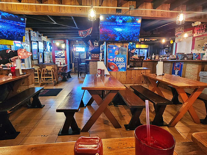 Rustic wooden tables and benches create the perfect backdrop for barbecue communion. This isn't fine dining&mdash;it's something better: honest food in an honest setting.