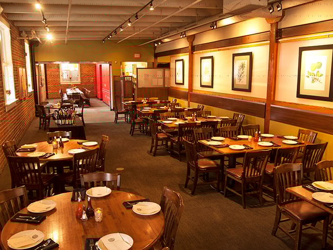 Wooden tables, exposed brick, and warm lighting create the perfect backdrop for the serious business of barbecue appreciation.