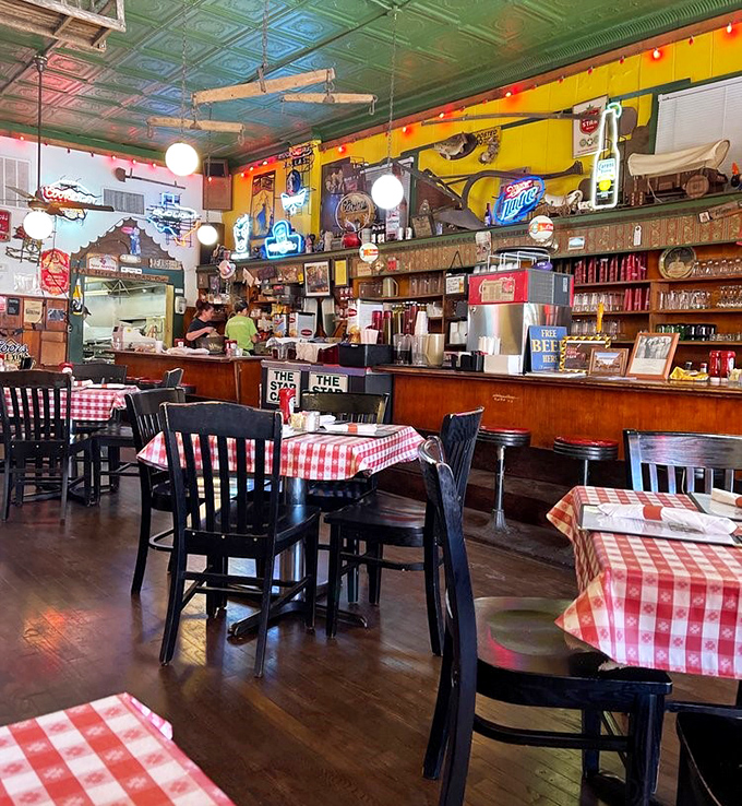 Step inside and you're greeted by the holy trinity of Texas dining: turquoise tin ceilings, red-checkered tablecloths, and enough memorabilia to fill a small museum.