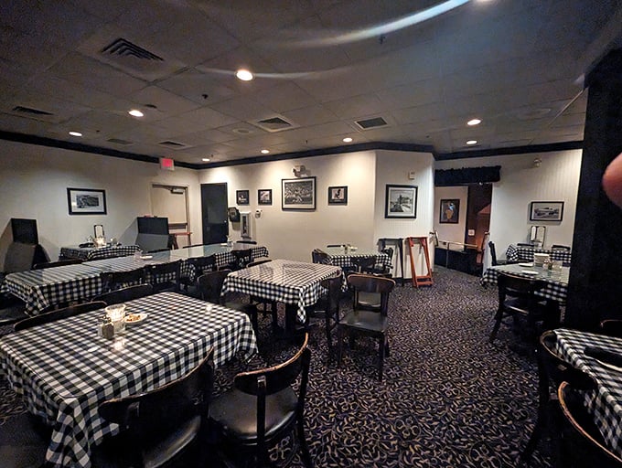 Classic checkered tablecloths and warm lighting create the perfect setting for memorable meals and great conversations.