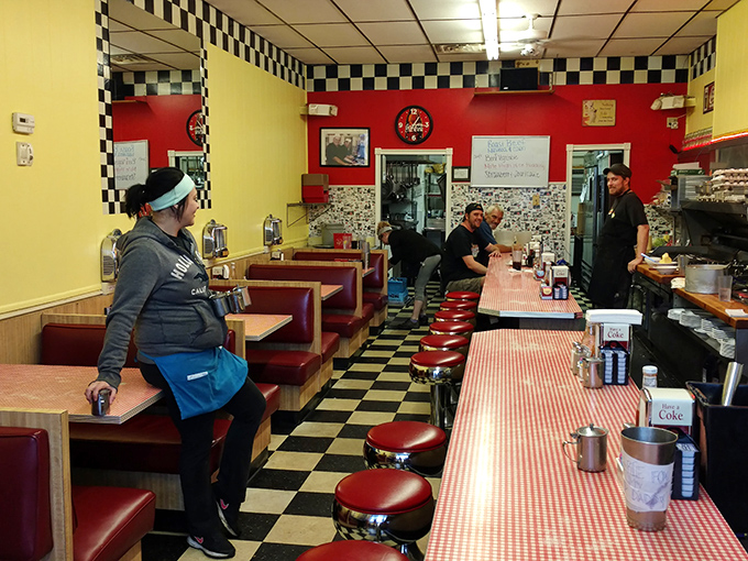 Classic checkered floors and red vinyl booths create that timeless diner atmosphere we all secretly crave.