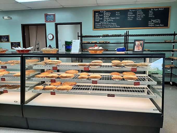 Pie paradise awaits! Rows of golden-crusted masterpieces line the display case, each one whispering sweet promises of deliciousness.