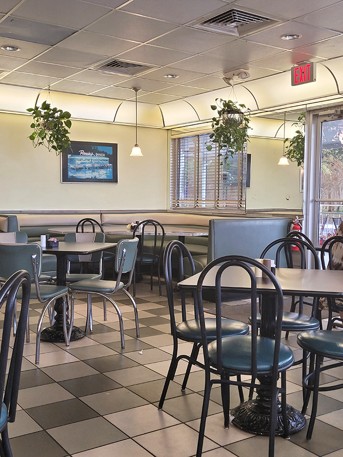 Inside, the checkerboard floor and cozy booths transport you to simpler times, when conversations flowed as freely as the coffee.