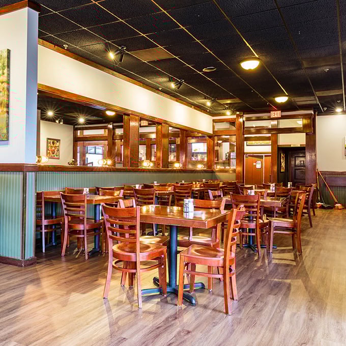 Warm wood tones and green wainscoting create that perfect "stay awhile" vibe. The dining room whispers of countless celebrations and comfort meals shared.
