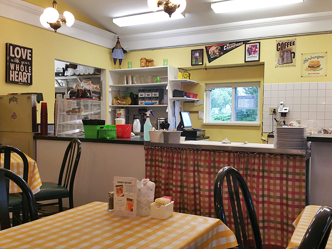 Cheerful yellow walls and checkered tablecloths create that "grandma's kitchen" vibe where calories don't count and seconds are mandatory.