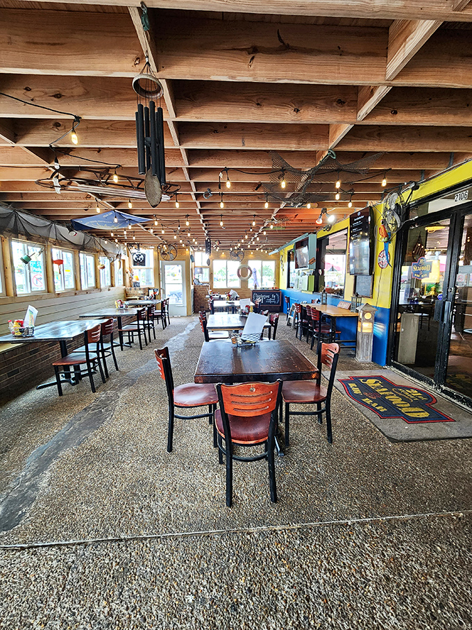 Step into this maritime wonderland where exposed beams and nautical charm create the perfect seafood sanctuary atmosphere.