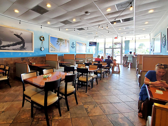 Coastal vibes meet breakfast perfection inside, where string lights and ocean photography create the perfect backdrop for morning feasting.