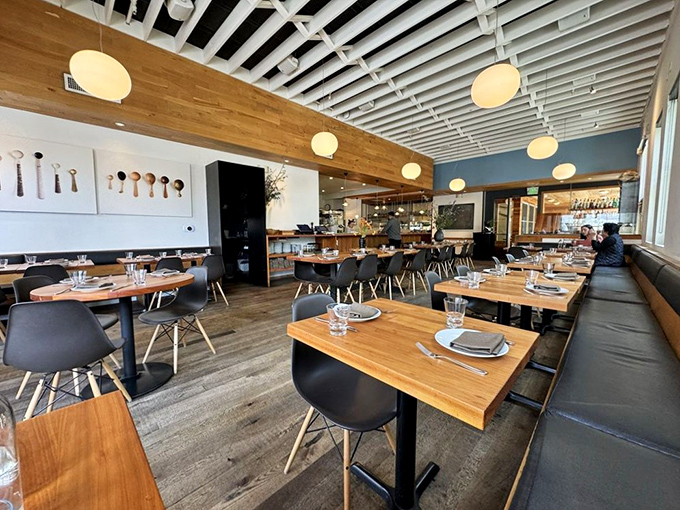 Clean lines, warm wood, and those globe lights create the perfect backdrop for pizza perfection. It's minimalist without being cold—exactly what you want.