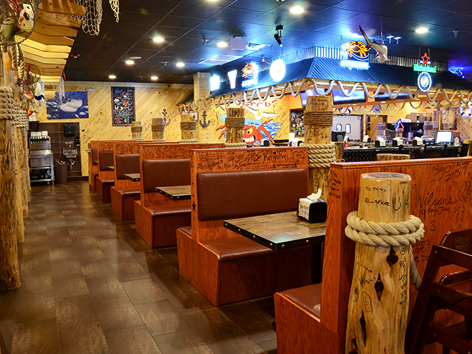 Nautical charm meets practical dining inside Storming Crab. Those wooden booths aren't just for show&mdash;they're battle stations for serious seafood consumption.