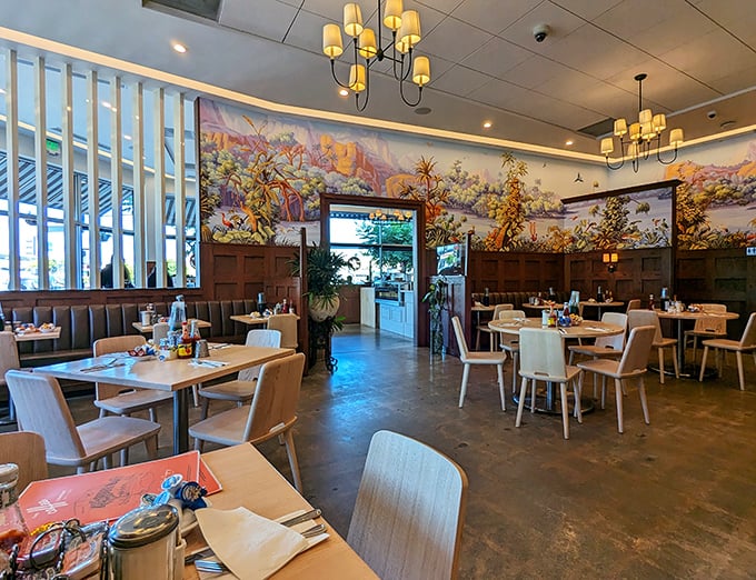 Warm wood, colorful murals, and just the right lighting &ndash; this dining room feels like the breakfast equivalent of a perfect hug.