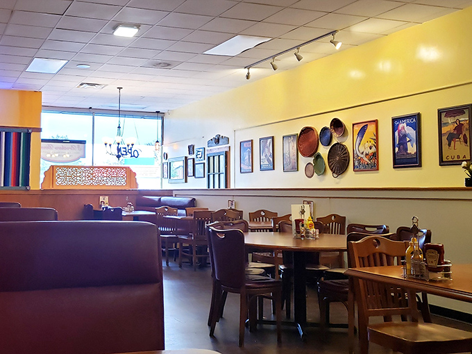 Sunshine-yellow walls and vintage travel posters create that rare atmosphere where you instantly feel like a regular, even on your first visit.