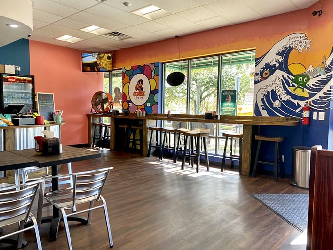Vibrant murals and warm wood tones create a space that's as colorful as the flavor profiles. The wave art practically guarantees a tsunami of deliciousness.