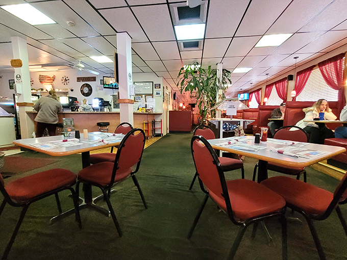Red booths and green carpet create the perfect time capsule of comfort. Like walking into your favorite aunt's dining room, if she could feed 50 people at once.