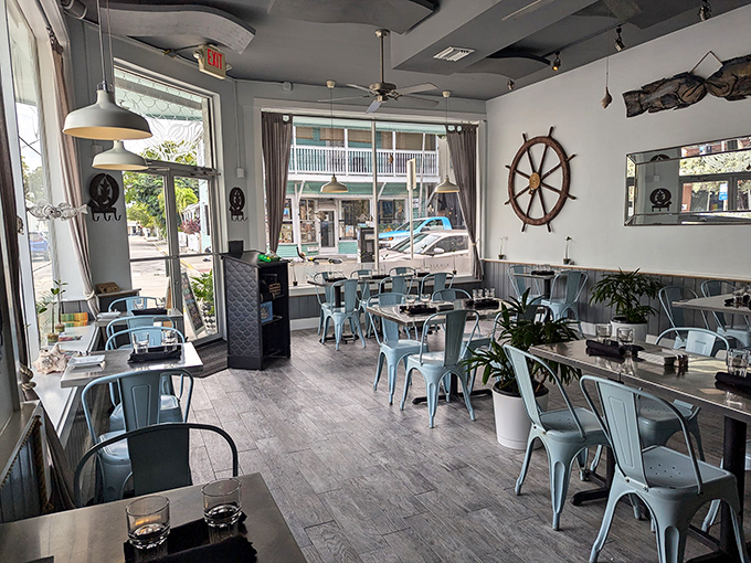 Nautical chic meets Key West casual. The ship's wheel and powder-blue chairs create an atmosphere where flip-flops and fine dining peacefully coexist. 