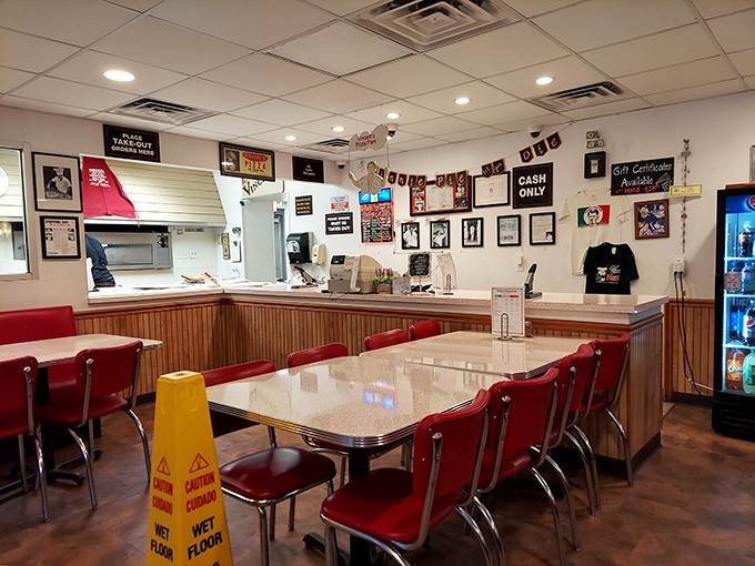 Red vinyl booths and wood paneling transport you to a simpler time. This isn't trendy retro; it's authentically unchanged since your parents' first date.