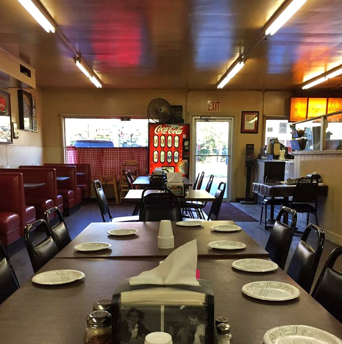 Where fluorescent lighting meets vinyl booths and paper plates&mdash;a reminder that the most memorable dining experiences often happen in places where ambiance takes a backseat to flavor.