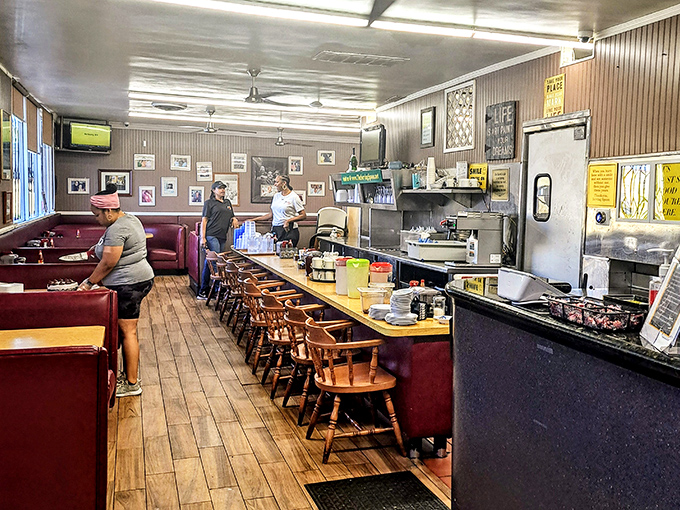 Classic counter seating puts you front-row for the kitchen symphony. Like watching jazz musicians, except the solos come on plates instead of saxophones.