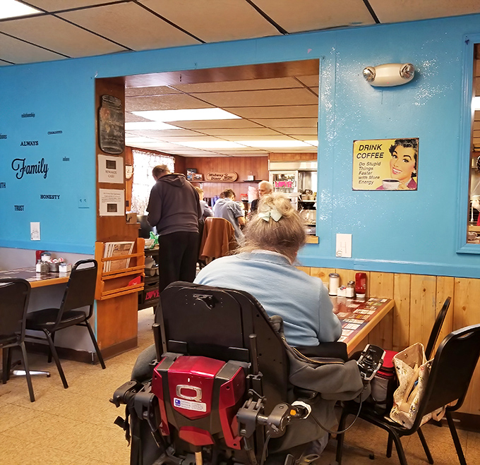 Blue walls adorned with words like "Family" and "Trust" set the tone at Midway, where mismatched coffee mugs and genuine hospitality are always on the menu.