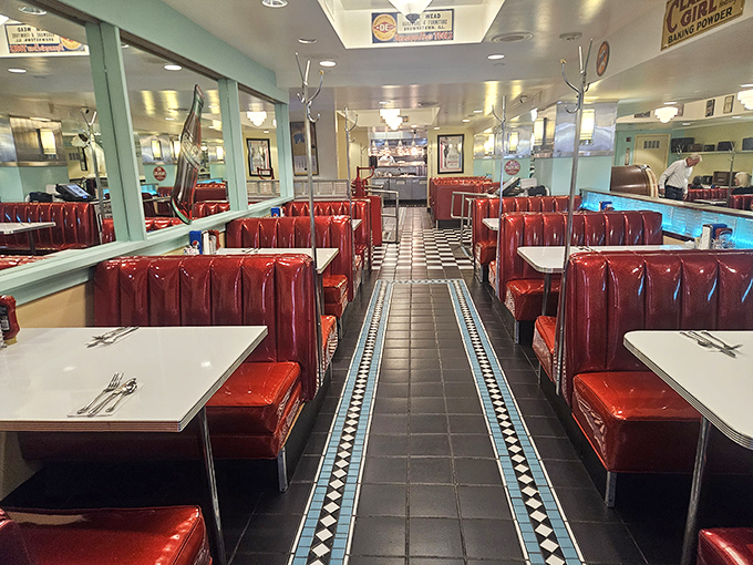 Red vinyl booths and checkered floors create the perfect stage for culinary magic to unfold.