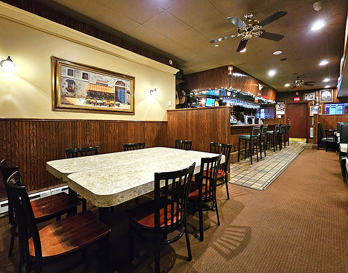 Classic wood paneling and comfortable seating create that "I've come home" feeling. This isn't trendy dining; this is where memories are made over generations.
