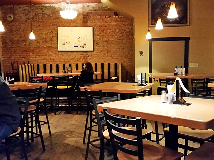 Exposed brick and warm lighting create the perfect backdrop for sauce-covered fingers and satisfied sighs.