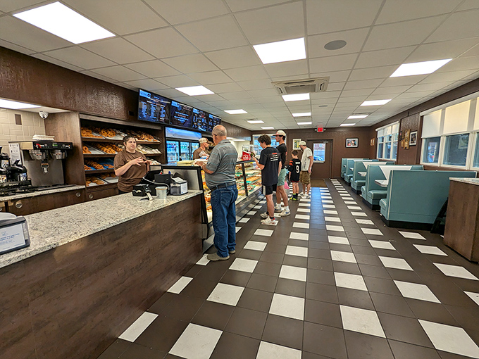 The classic black and white checkered floor leads you to donut nirvana, while turquoise booths invite you to stay awhile.