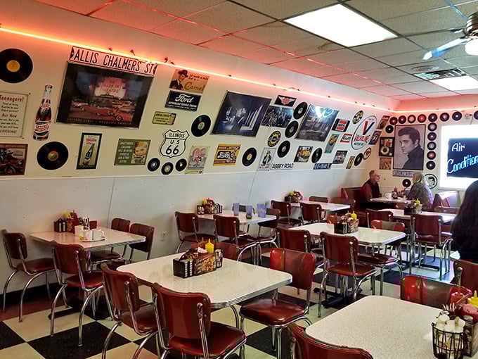 Step inside and you're transported to a bygone era where vinyl records line the walls, Route 66 memorabilia abounds, and those cherry-red booths promise comfort for your posterior and palate alike.