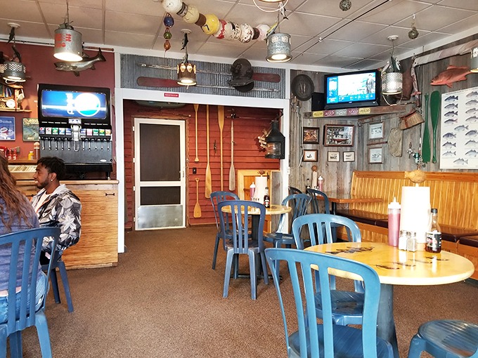 Buoys and fishing gear dangle from the ceiling like maritime chandeliers, creating the perfect backdrop for Great Lakes seafood perfection.