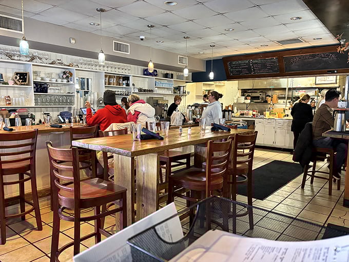 Where breakfast dreams come true &ndash; the bustling interior combines warm woods and open kitchen views, letting you witness the morning magic unfold.