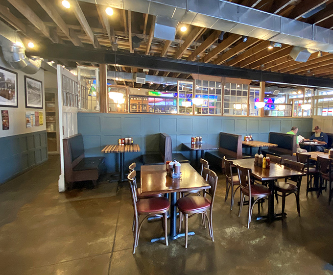 Inside, exposed wooden beams and cozy booths create that perfect "stay awhile" atmosphere where conversations flow as freely as the sweet tea.