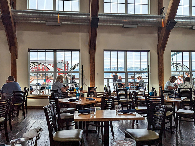 Massive timber beams frame picture windows that turn ordinary dining into dinner theater, with the Columbia River and bridge playing starring roles. 