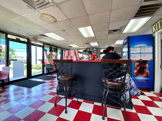That classic red and white checkered floor isn't just decoration—it's a promise that authentic, no-frills deliciousness is about to happen.